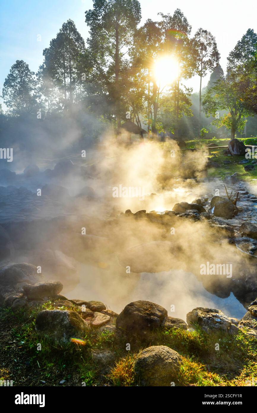 Natural hot spring with misty and morning sunrisewarm sunlight at Chae Son National Park ...
