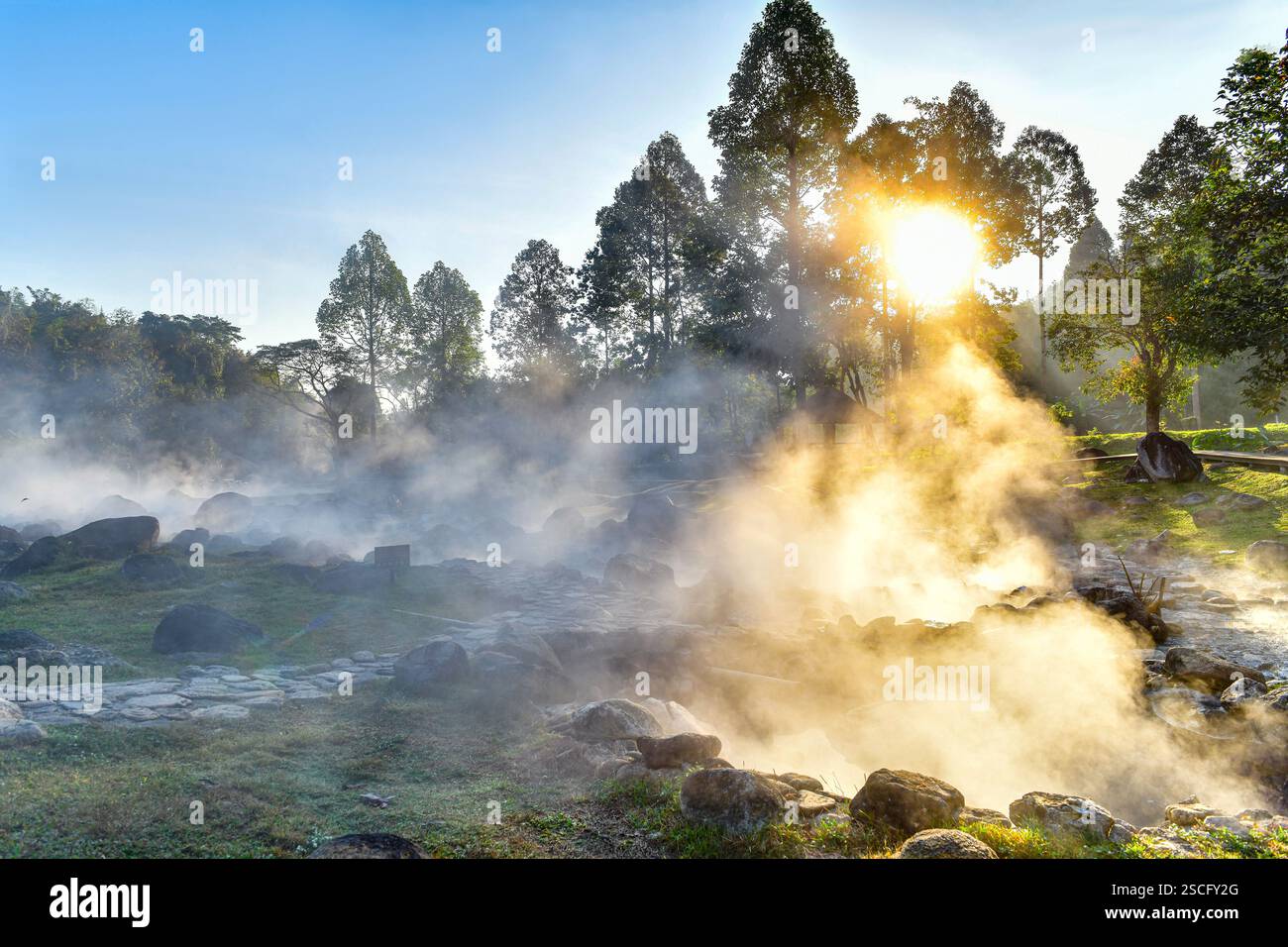 Natural hot spring with misty and morning sunrisewarm sunlight at Chae Son National Park ...