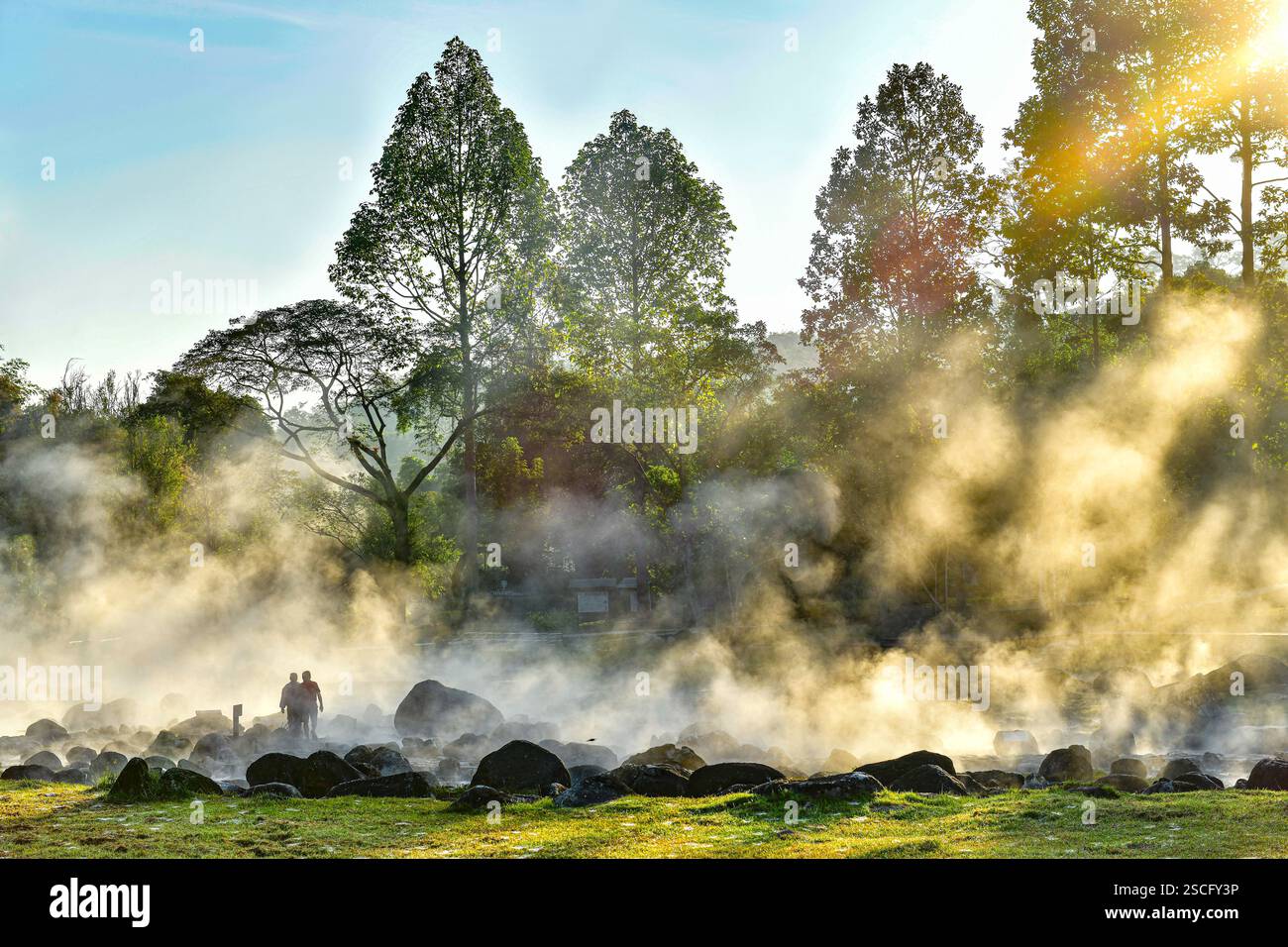 Natural hot spring with misty and morning sunrisewarm sunlight at Chae Son National Park ...