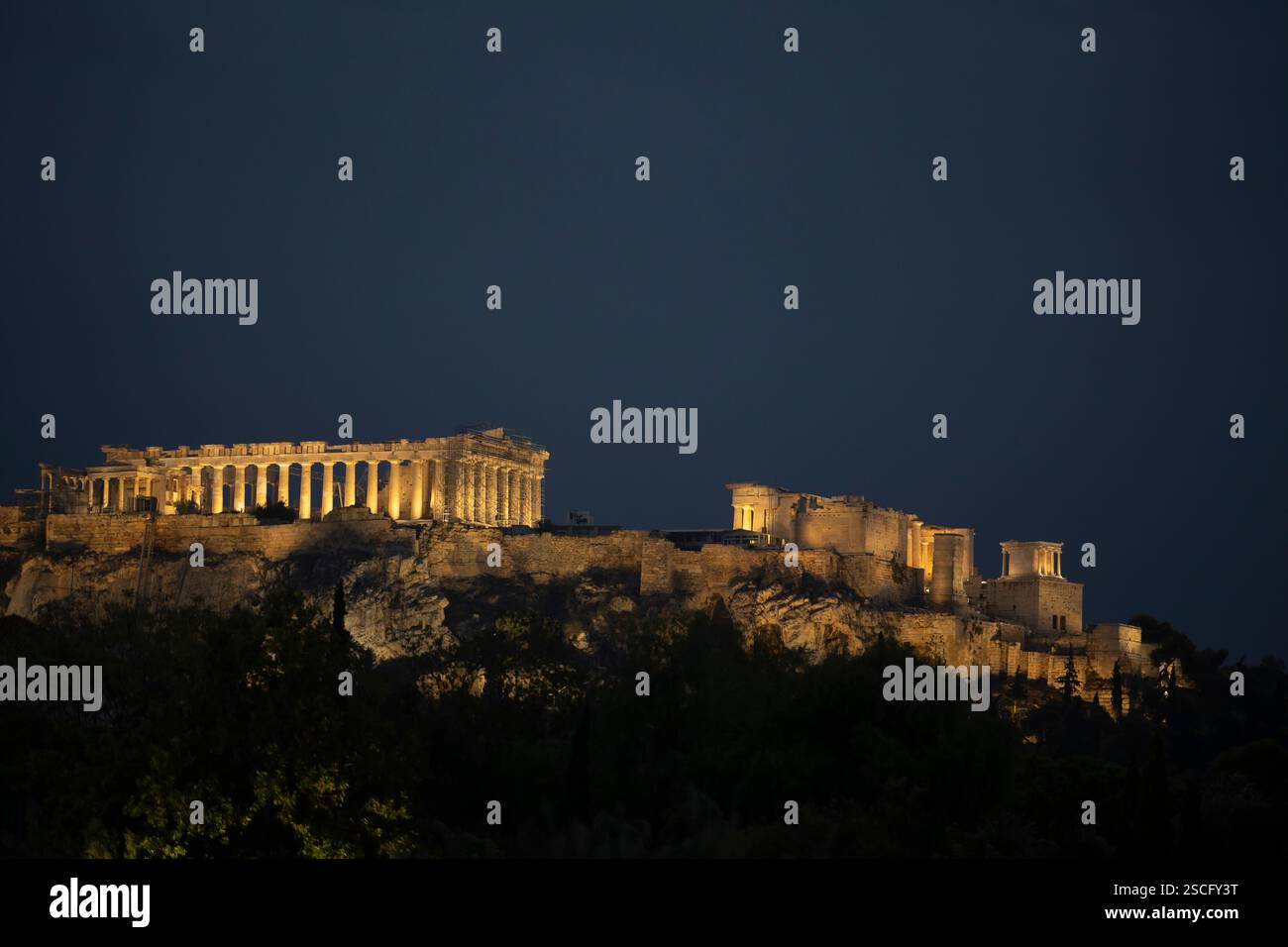 Acropolis lighted at night at the blue hour from down in the city of Athens, Greece Stock Photo ...