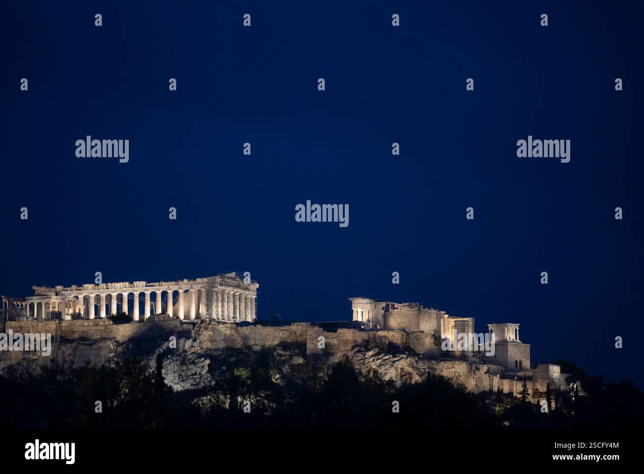 Acropolis lighted at night at the blue hour from down in the city of Athens, Greece Stock Photo ...