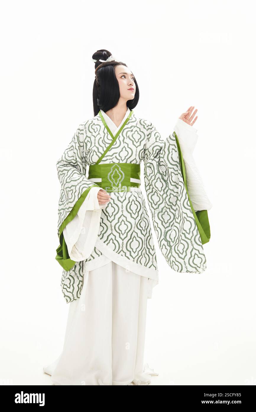 Teenage girl dressed in Chinese Han Dynasty costume on white background ...