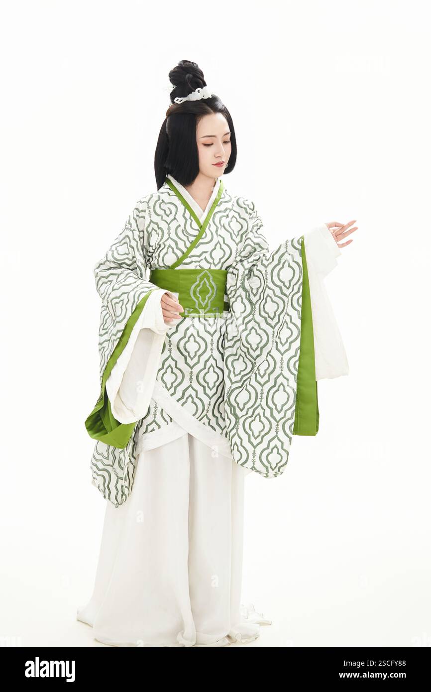 Teenage girl dressed in Chinese Han Dynasty costume on white background ...