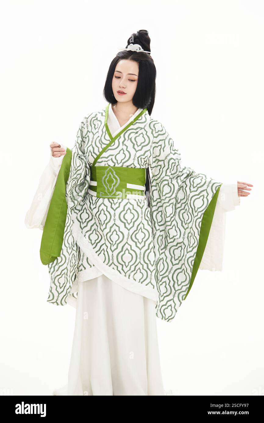 Teenage girl dressed in Chinese Han Dynasty costume on white background ...