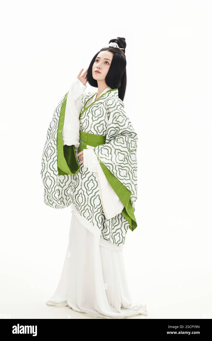 Teenage girl dressed in Chinese Han Dynasty costume on white background ...