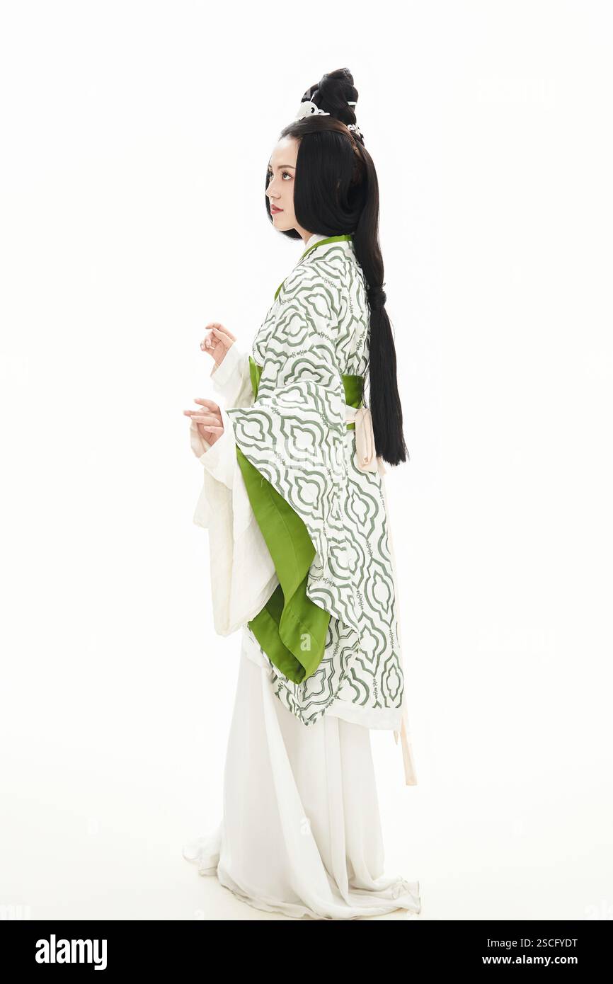 Teenage girl dressed in Chinese Han Dynasty costume on white background ...