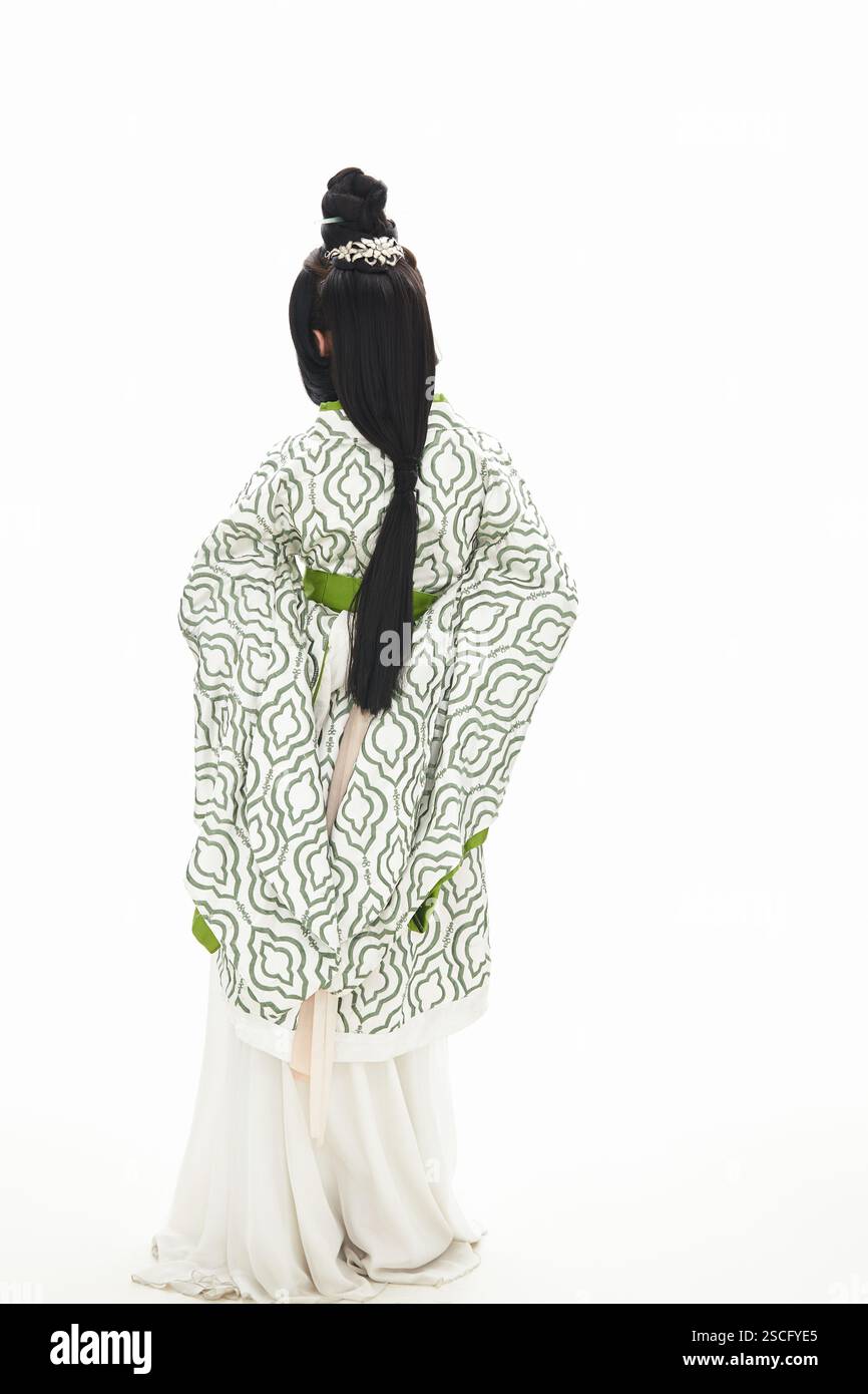 Teenage girl dressed in Chinese Han Dynasty costume on white background ...
