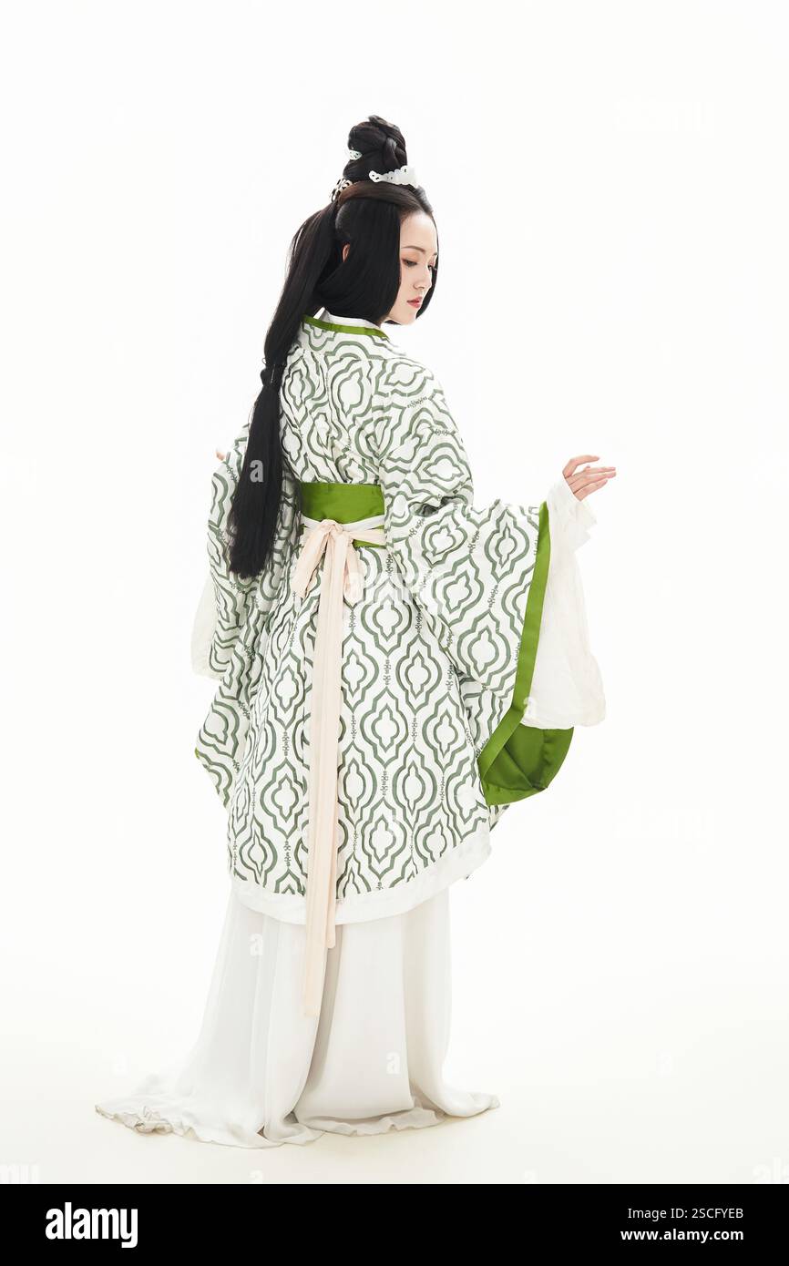 Teenage girl dressed in Chinese Han Dynasty costume on white background ...
