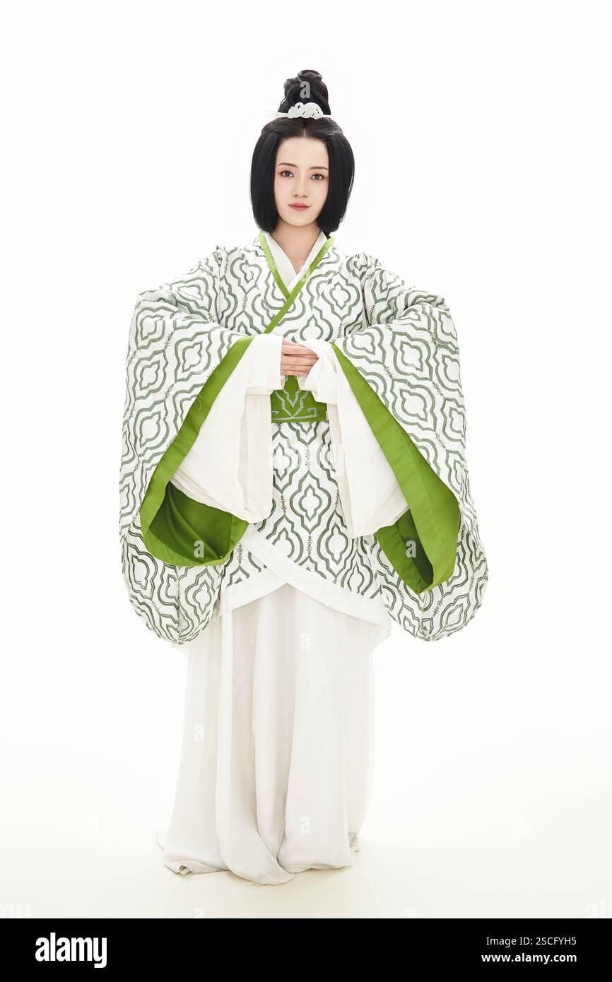 Teenage girl dressed in Chinese Han Dynasty costume on white background ...