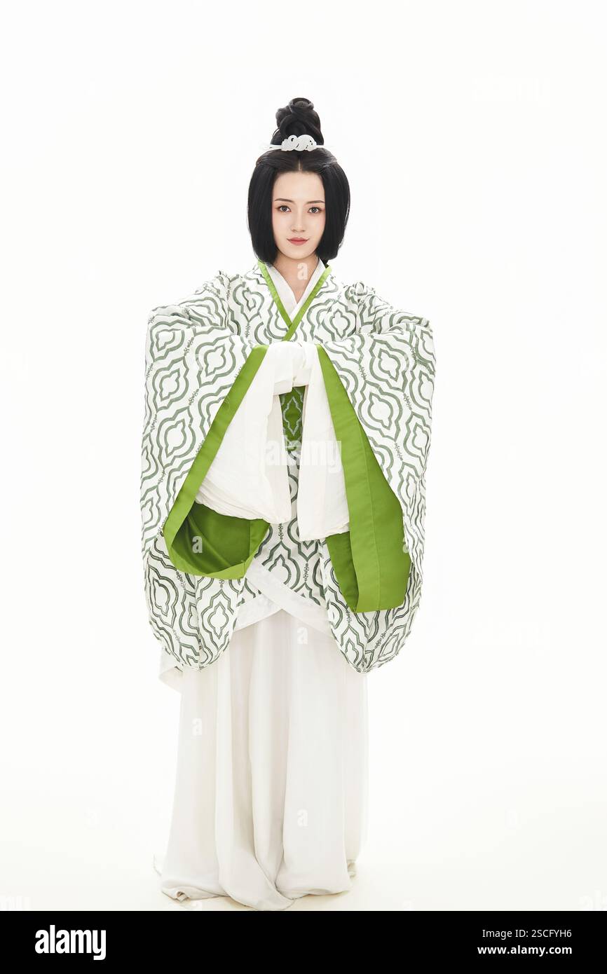 Teenage girl dressed in Chinese Han Dynasty costume on white background ...