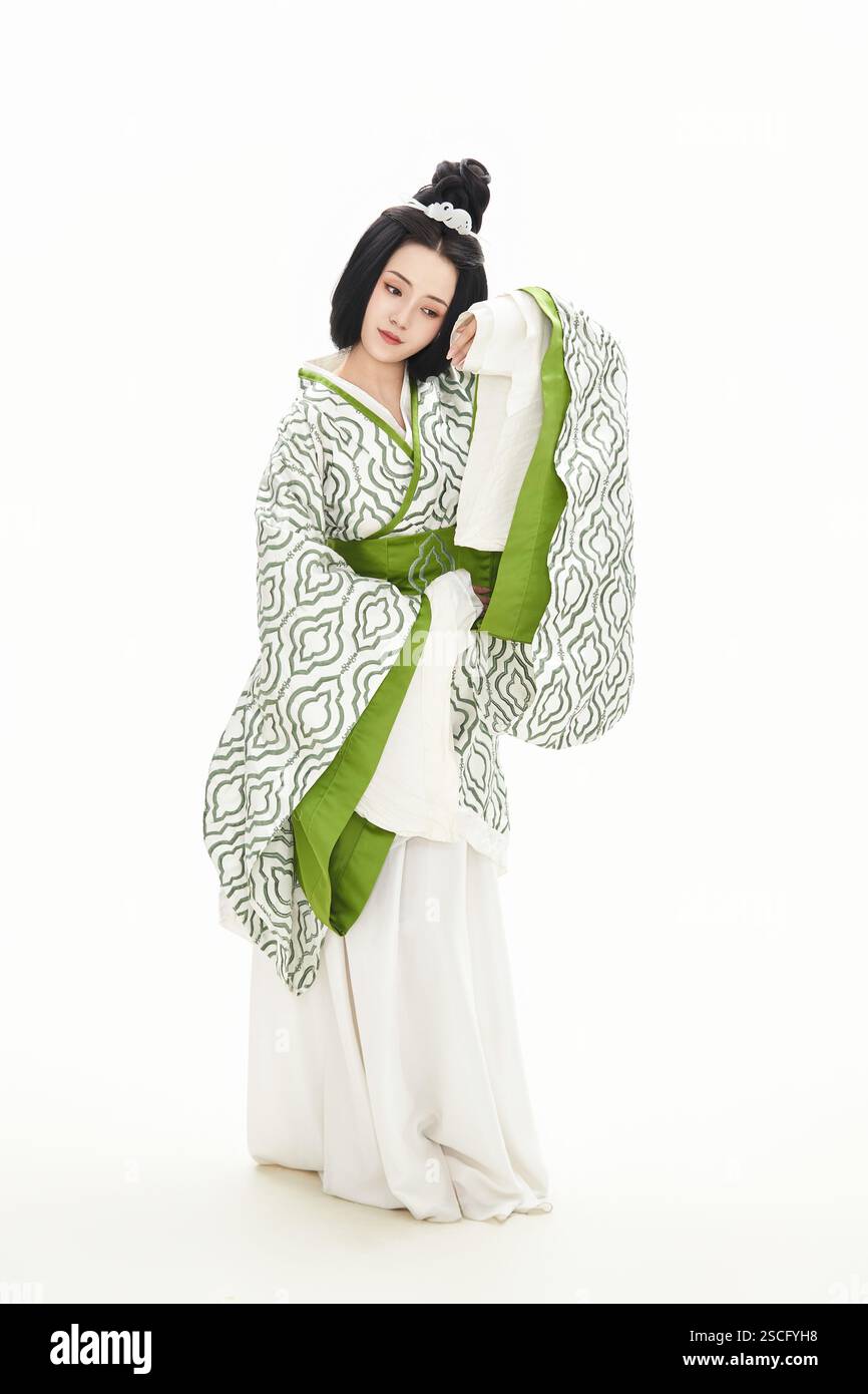Teenage girl dressed in Chinese Han Dynasty costume on white background ...