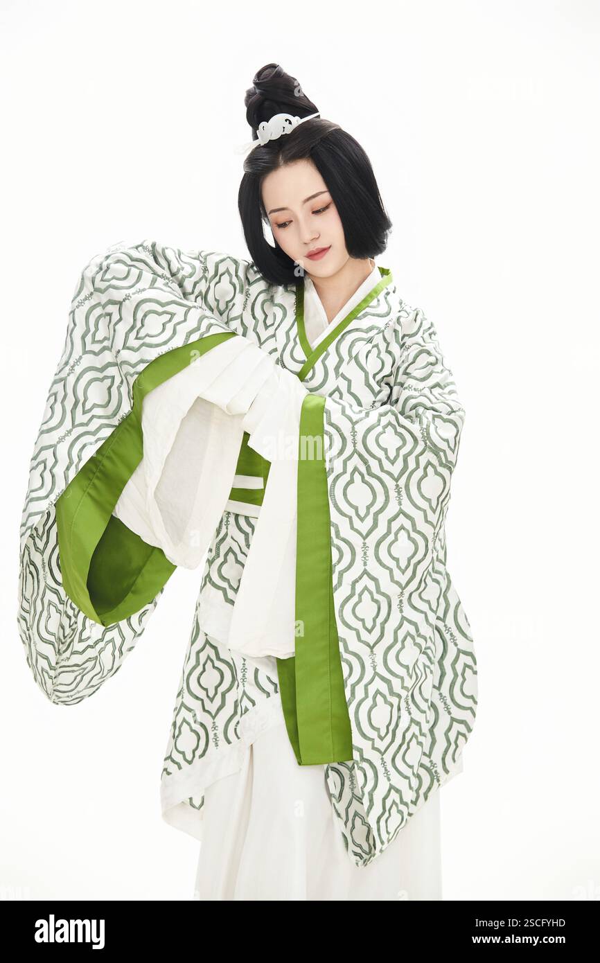 Teenage girl dressed in Chinese Han Dynasty costume on white background ...