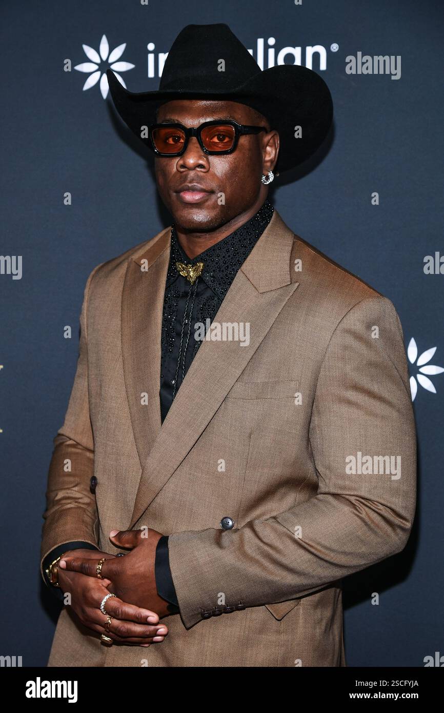 Kelon White walking on the red carpet at NFL Honors at the Saenger ...