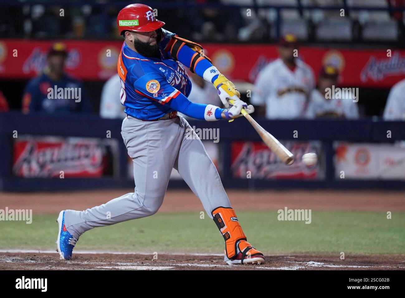 Puerto Rico's Emmanuel Rivera hits a double against Venezuela during a ...