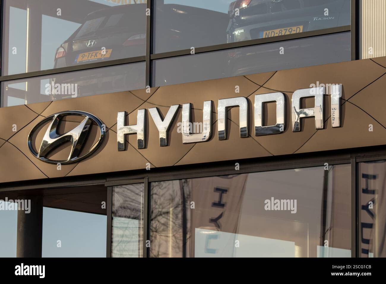 Hyundai logo at the car dealer in Nieuwegein. Hyundai, is a South ...