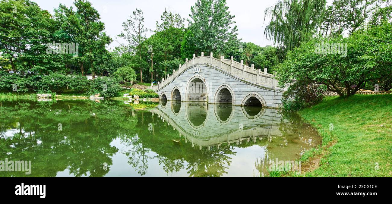 Arch bridge in Huanhuaxi Park, Chengdu, Sichuan, China Stock Photo - Alamy