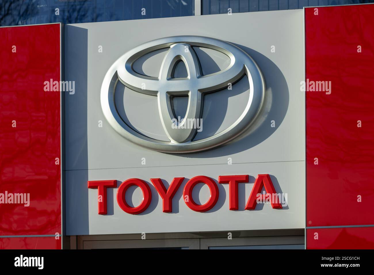 Toyota logo at the car dealer in Nieuwegein. Toyota Motor Corporation ...