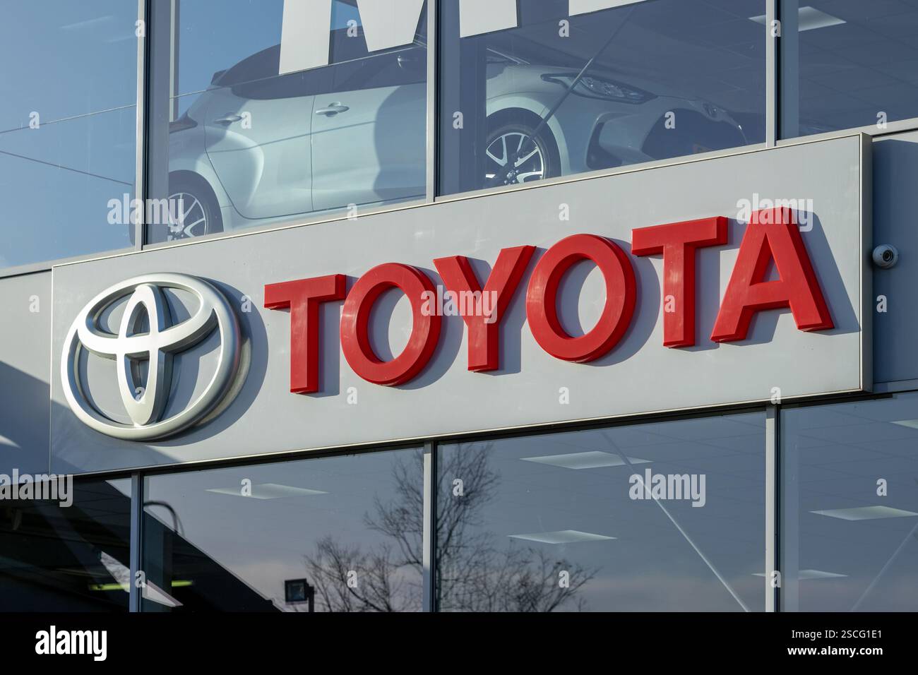 Toyota logo at the car dealer in Nieuwegein. Toyota Motor Corporation ...
