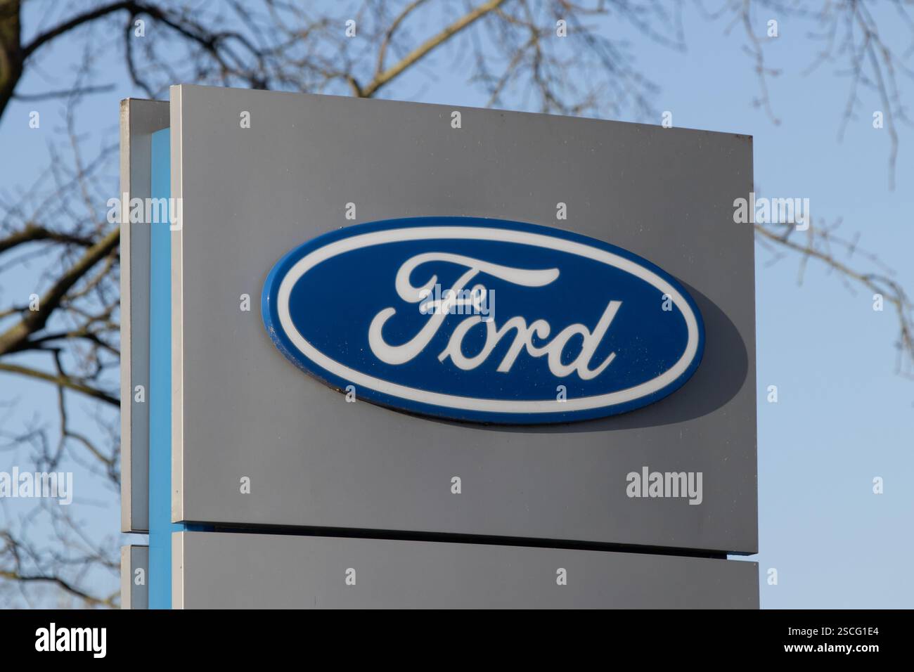 Ford logo at the car dealer in Nieuwegein. Ford is a representative of ...