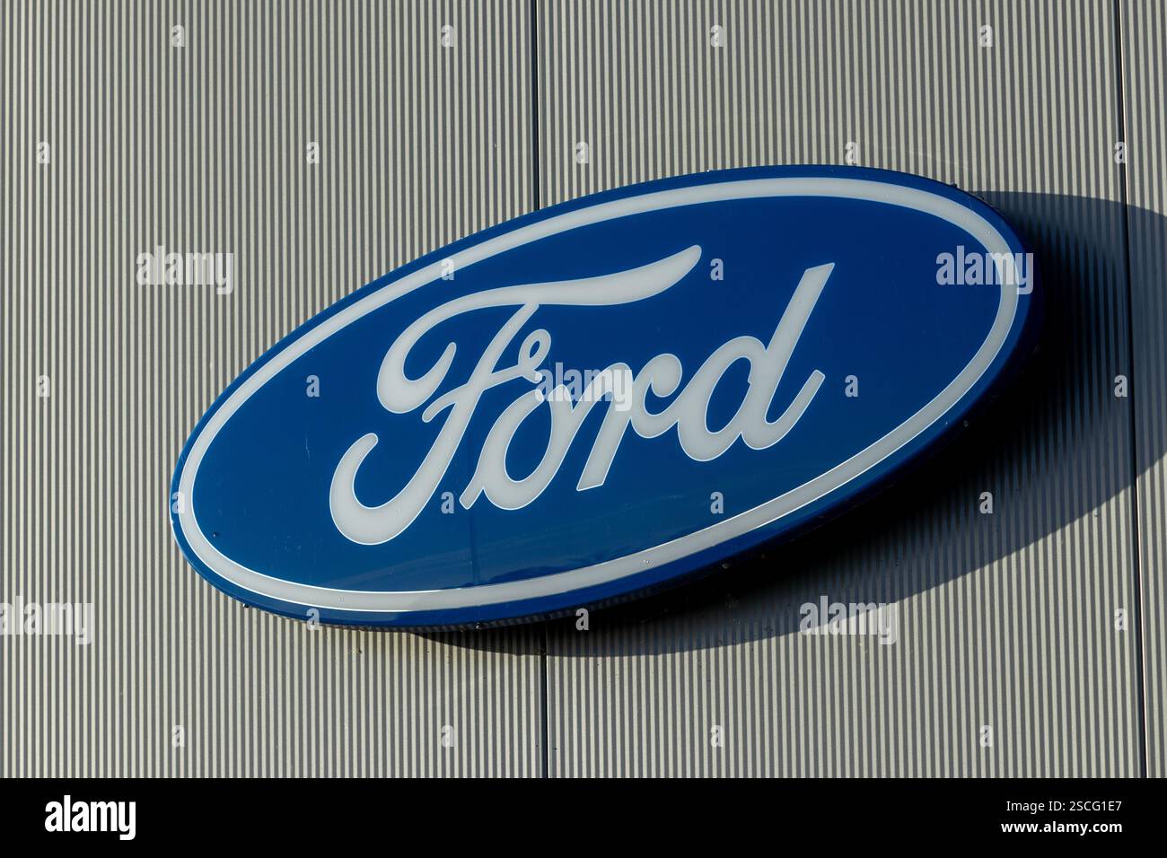 Ford logo at the car dealer in Nieuwegein. Ford is a representative of ...