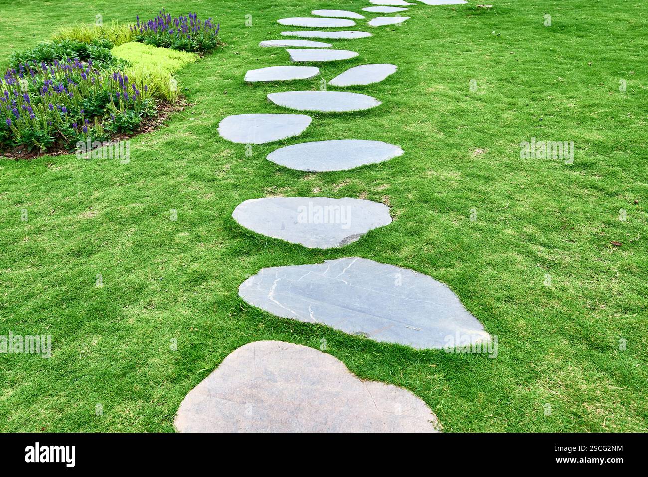 Cobblestone path in the park Stock Photo - Alamy