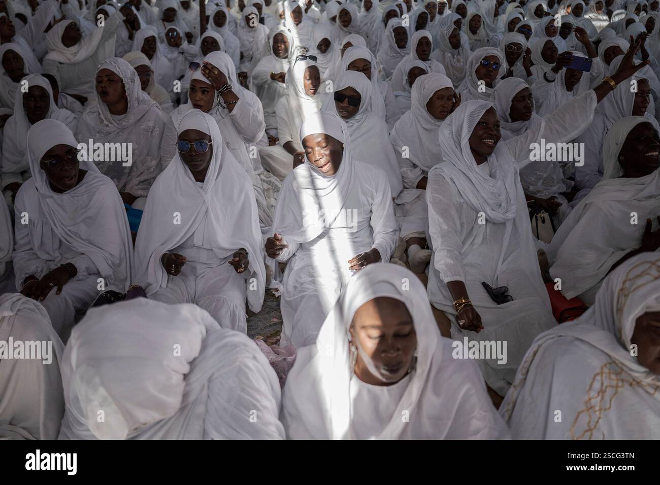 Dressed in white robes to symbolize purity and equality before God ...