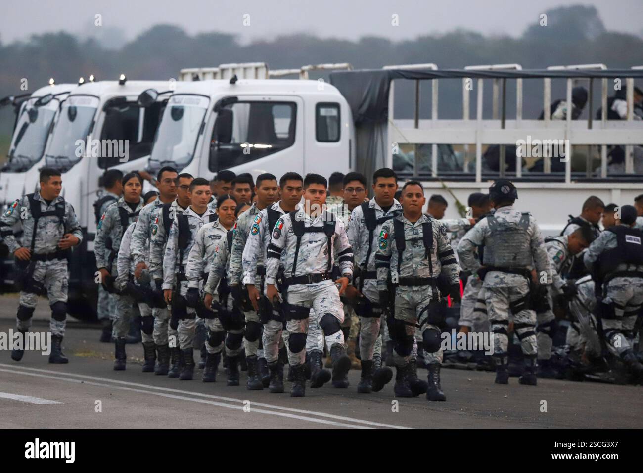 Mexican National Guards prepare to board an aircraft at the ...