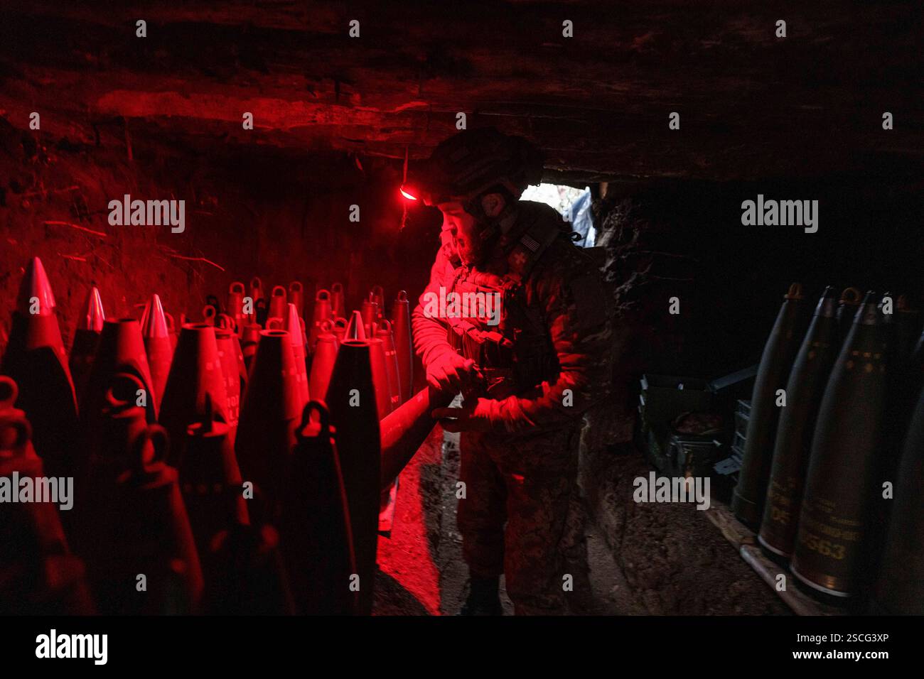 A Ukrainian serviceman of the 148th artillery brigade prepares 155mm ...