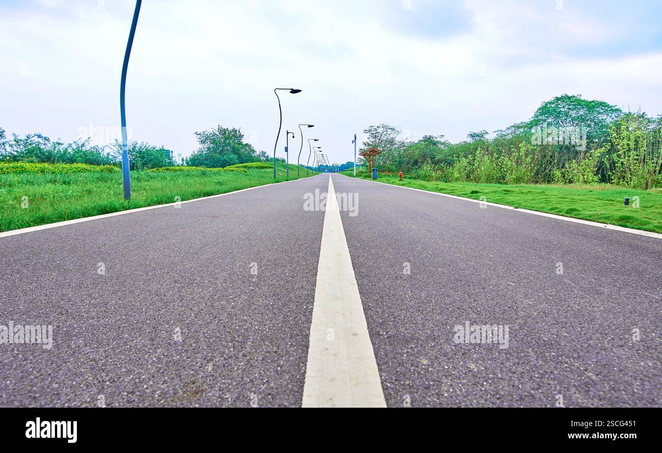 A straight road stretches into the distance Stock Photo - Alamy