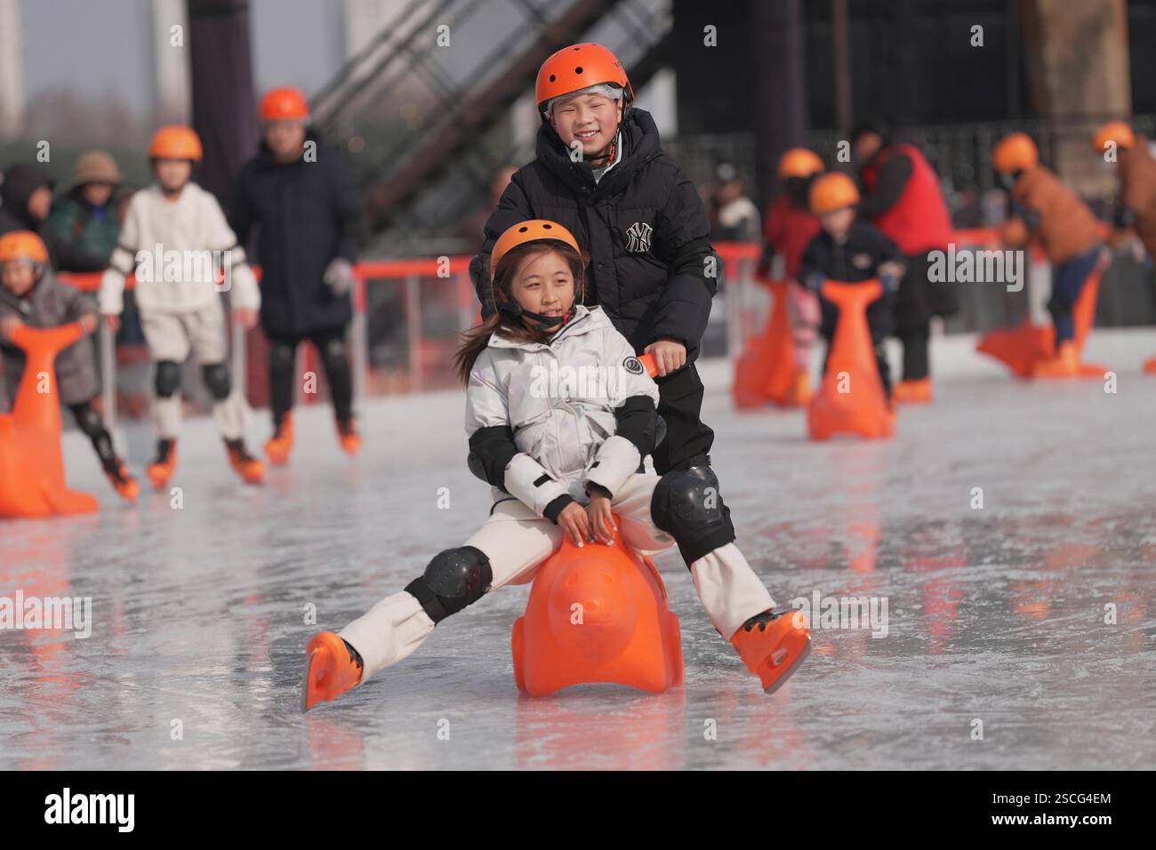 **CHINESE MAINLAND, HONG KONG, MACAU AND TAIWAN OUT** Visitors skate at ...