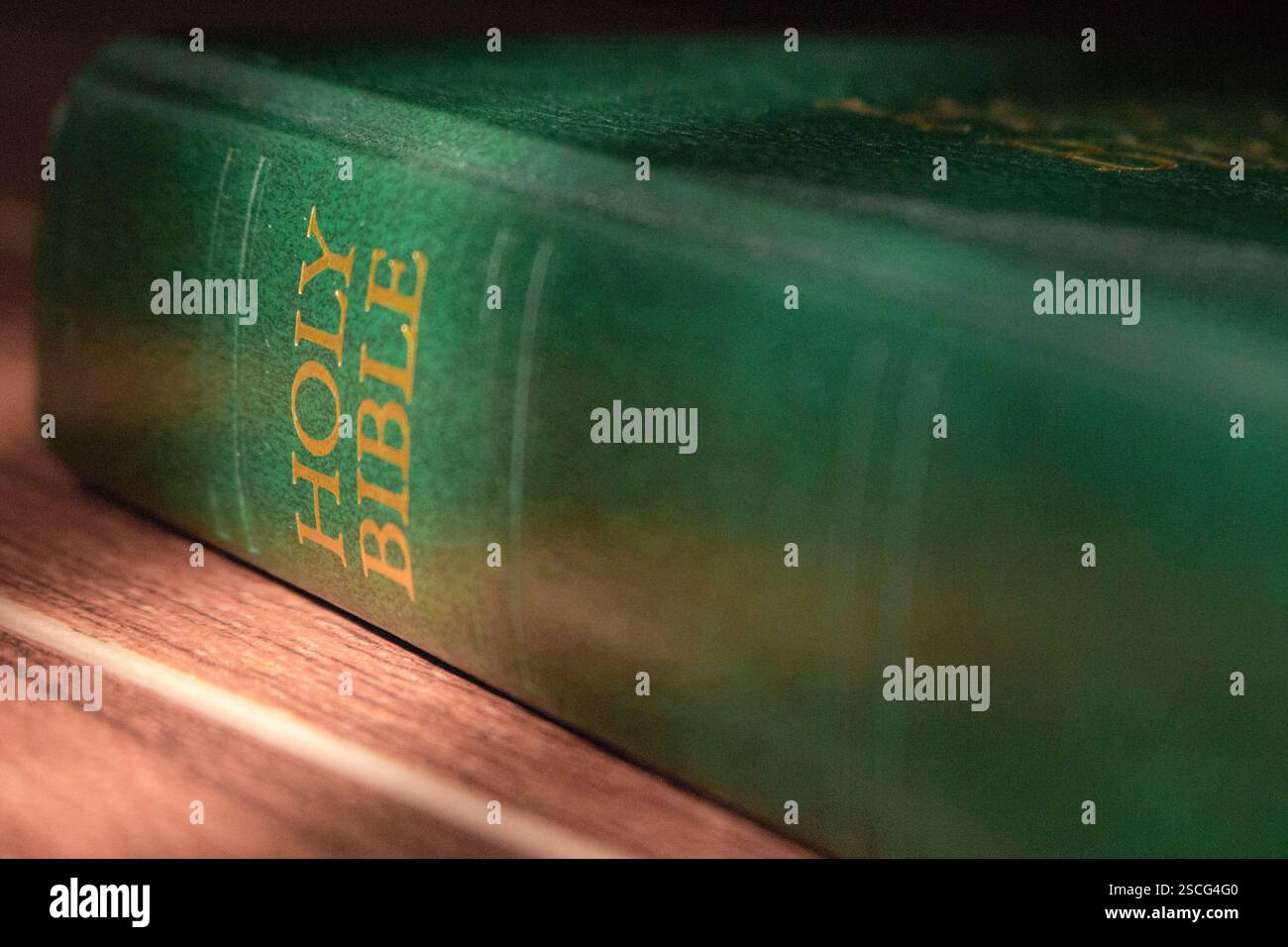Green Holy Bible in sunlight. Religion and faith concept. Religious ...