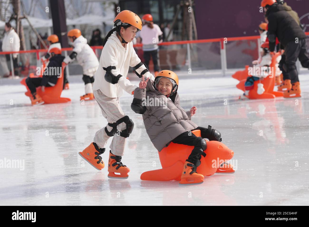 **CHINESE MAINLAND, HONG KONG, MACAU AND TAIWAN OUT** Visitors skate at ...