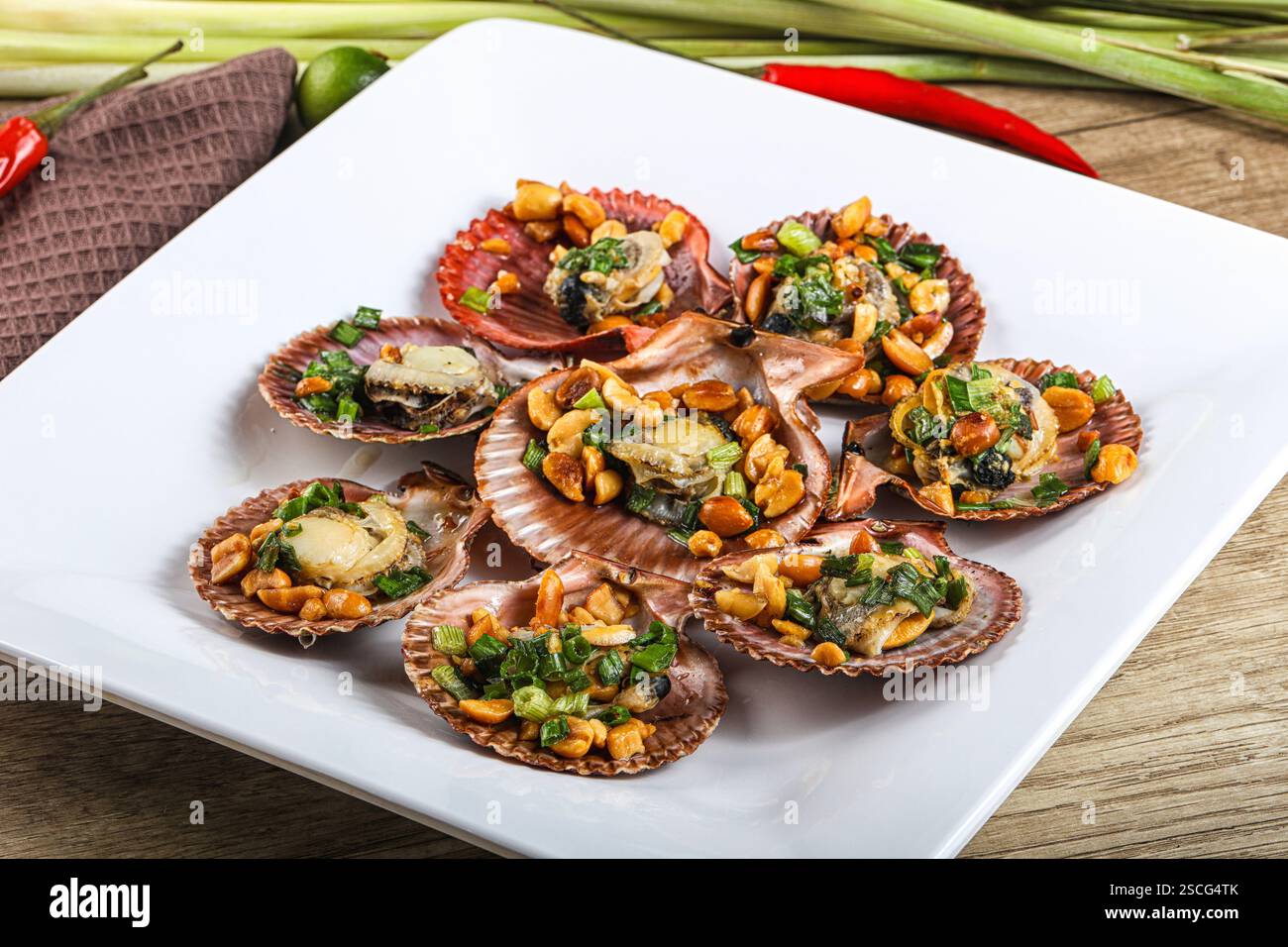 Baked scallops with scalion oil and green onion Stock Photo - Alamy