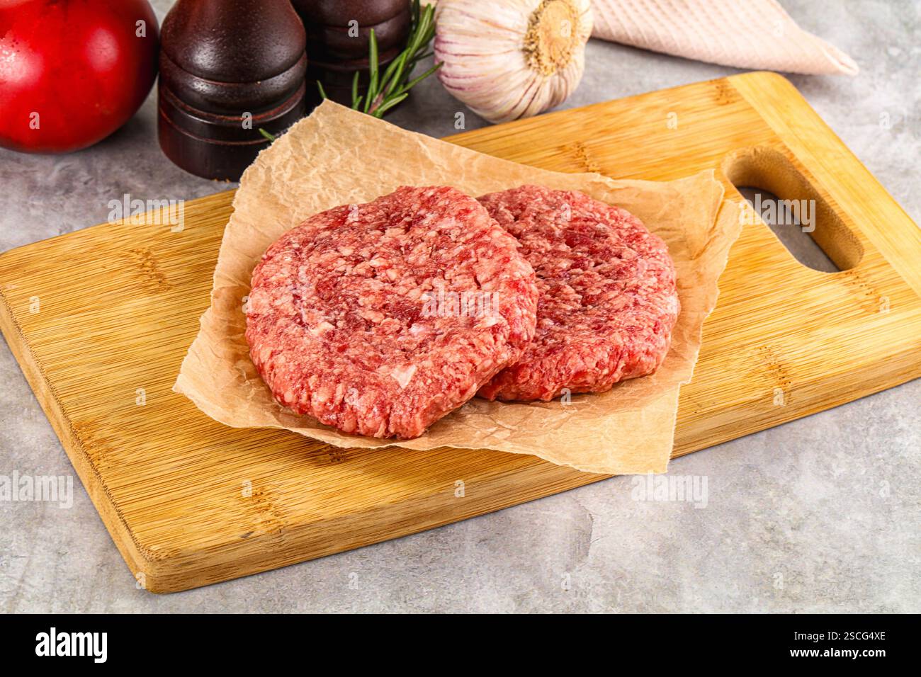 Raw round uncooked beef cutlet minced meat Stock Photo - Alamy