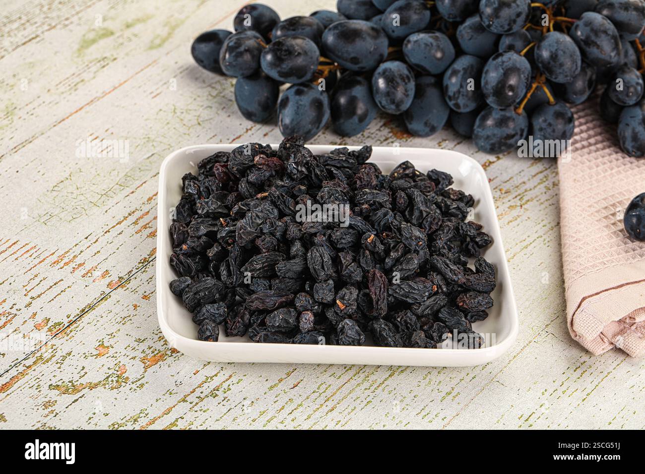 Dry ripe sweet blue raisin heap Stock Photo - Alamy