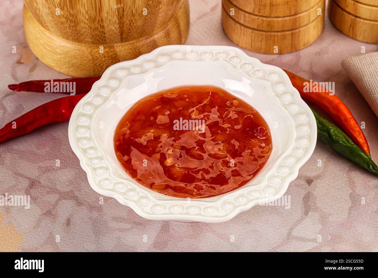 Sweet and sour chili sauce with pineapple pieces Stock Photo - Alamy