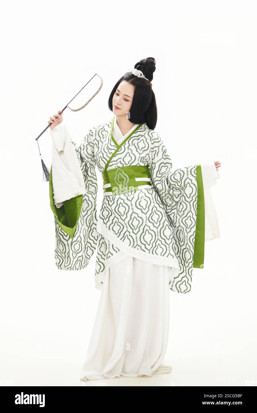 Teenage girl dressed in Chinese Han Dynasty costume on white background ...