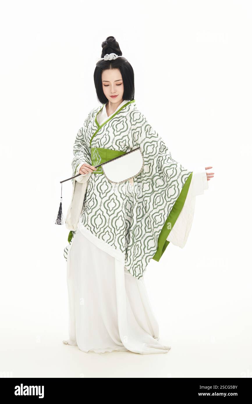 Teenage girl dressed in Chinese Han Dynasty costume on white background ...