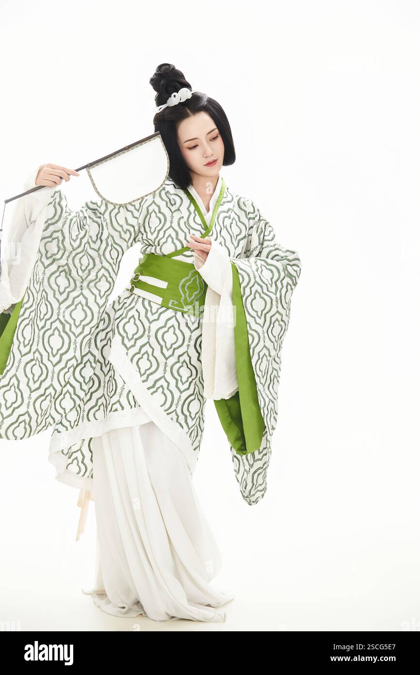 Teenage girl dressed in Chinese Han Dynasty costume on white background ...