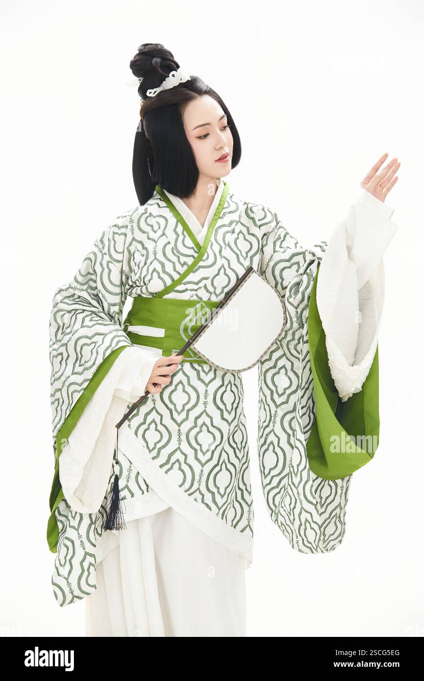 Teenage girl dressed in Chinese Han Dynasty costume on white background ...