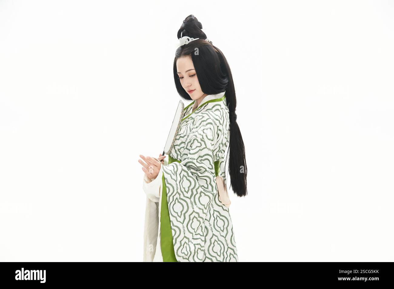 Teenage girl dressed in Chinese Han Dynasty costume on white background ...