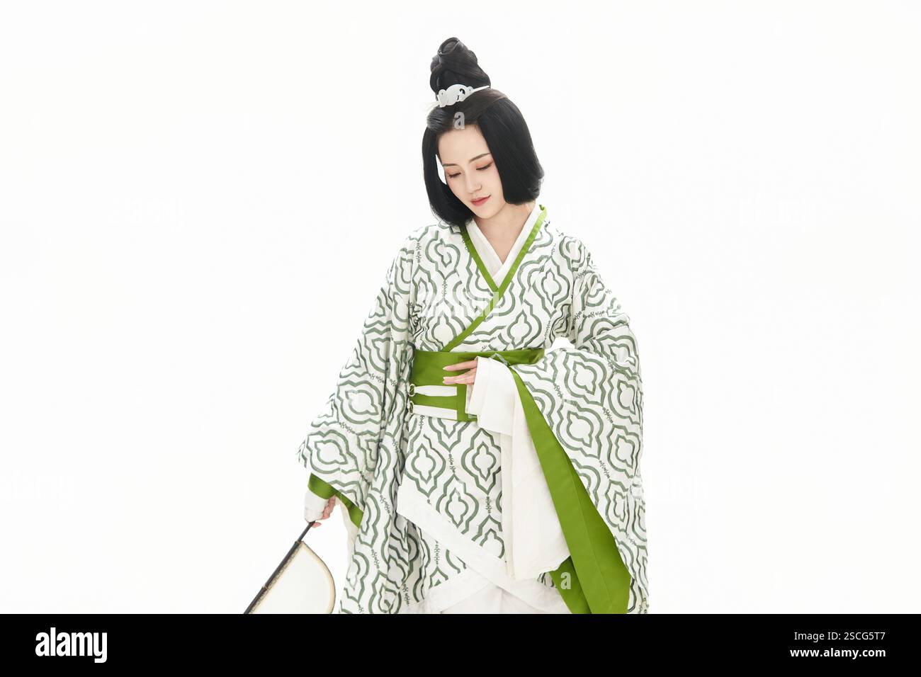 Teenage girl dressed in Chinese Han Dynasty costume on white background ...