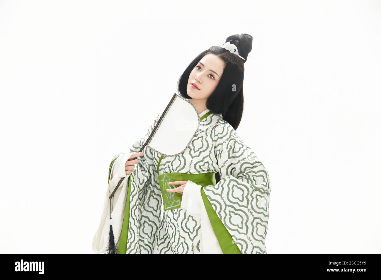 Teenage girl dressed in Chinese Han Dynasty costume on white background ...