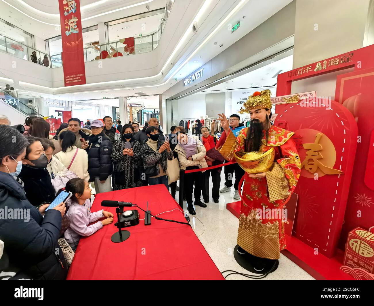 People visit an AI-themed technology temple fair in Beijing, China, 31 ...