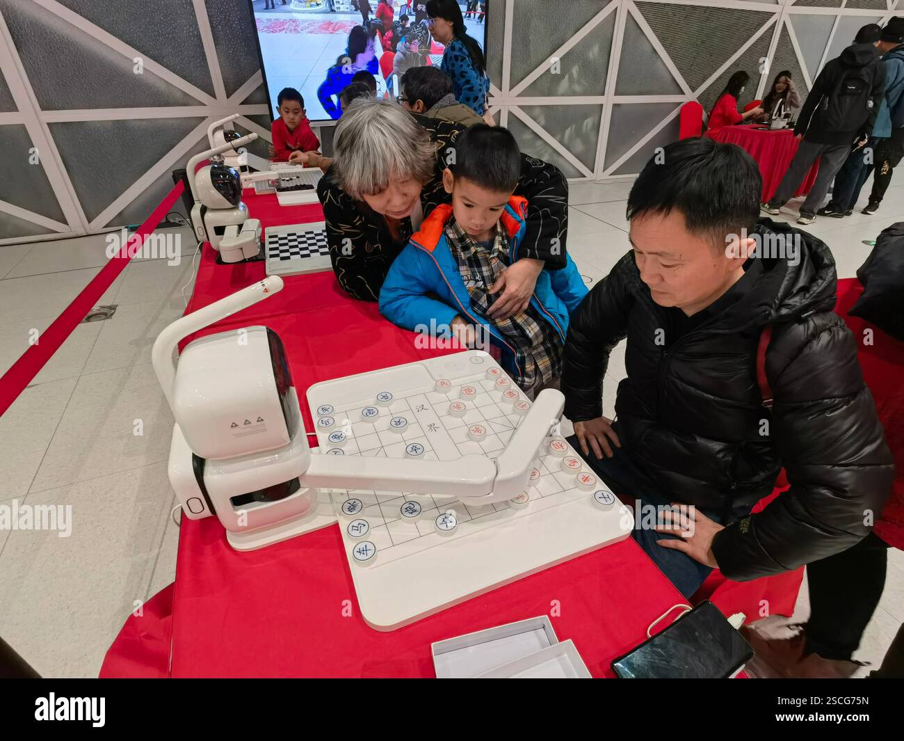 People visit an AI-themed technology temple fair in Beijing, China, 31 ...
