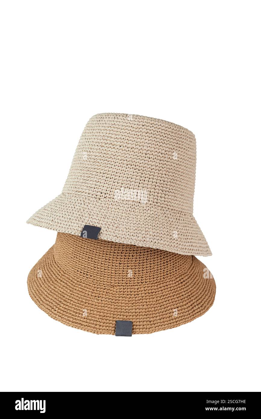 Beige and brown isolated hats lying one on another on a white ...