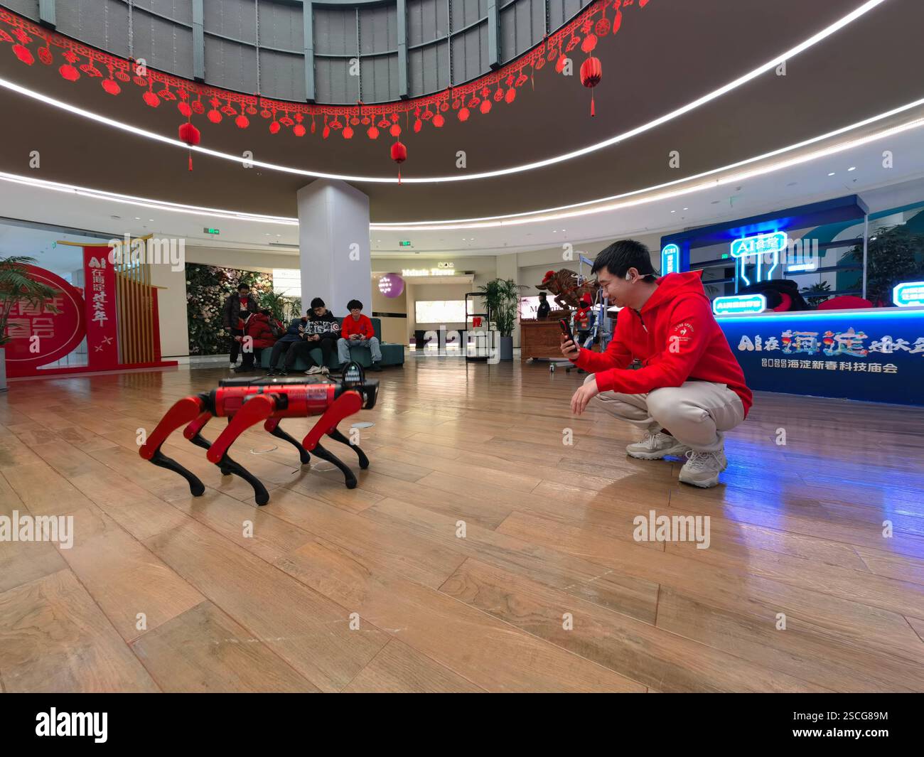 People visit an AI-themed technology temple fair in Beijing, China, 31 ...