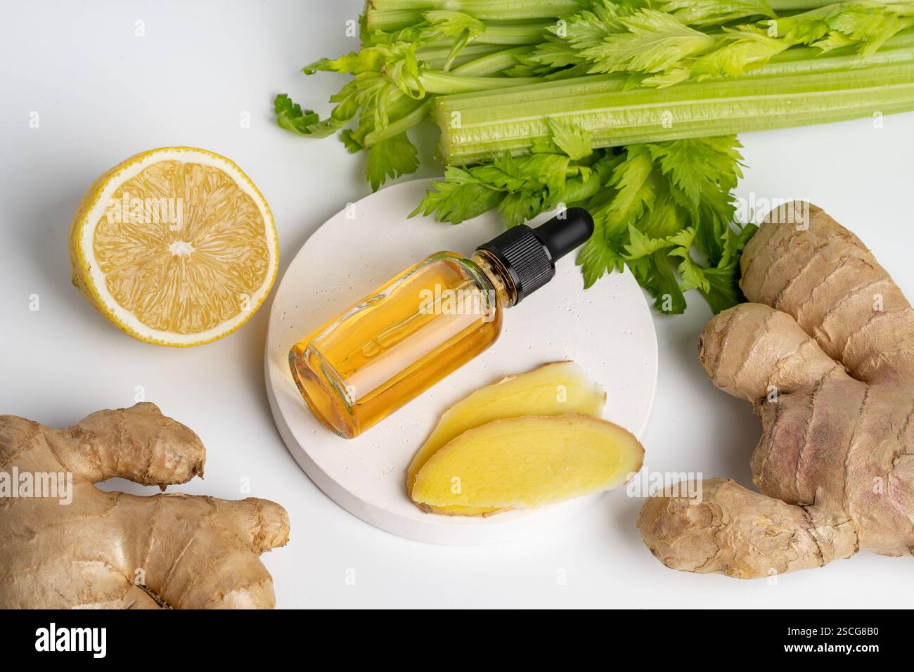 Ginger and lemon extract oil serum for health on white podiums ...