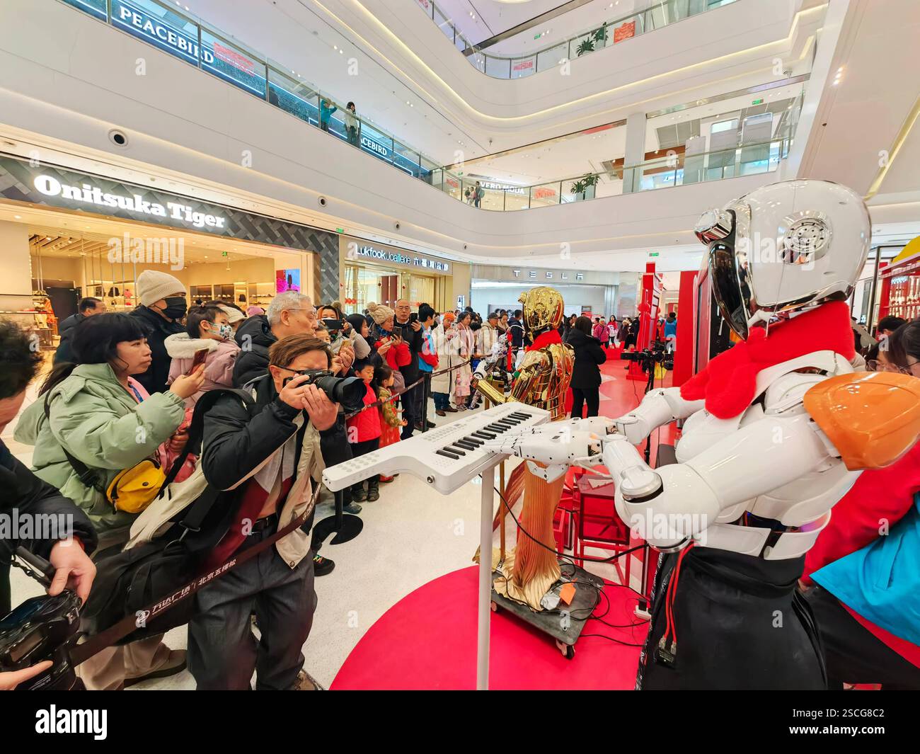 People visit an AI-themed technology temple fair in Beijing, China, 31 ...