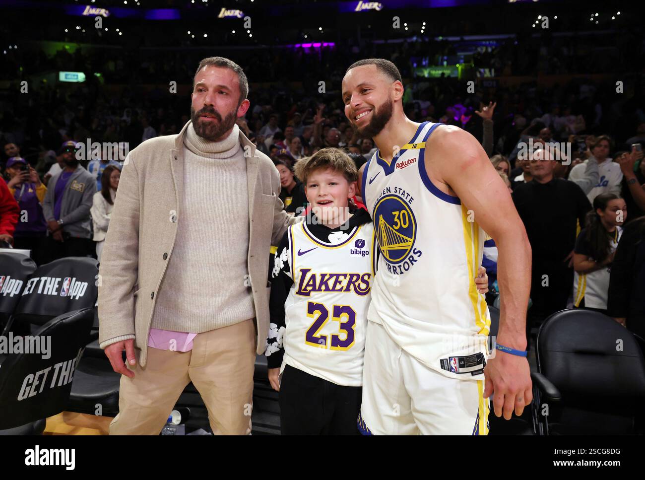 Golden State Warriors guard Stephen Curry, right, poses with Ben ...